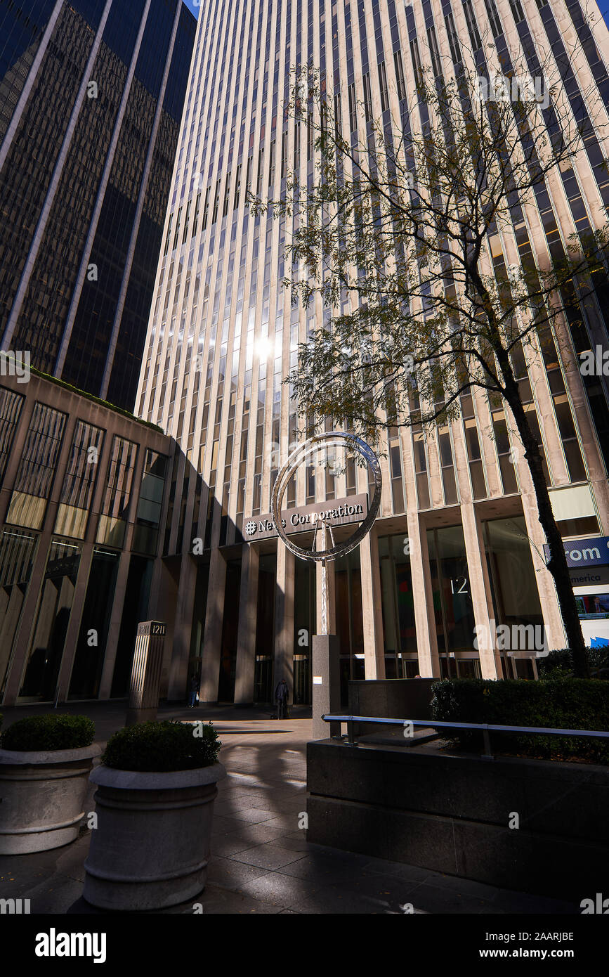 view of the massive midtown buildings in Manhattan from street level ...