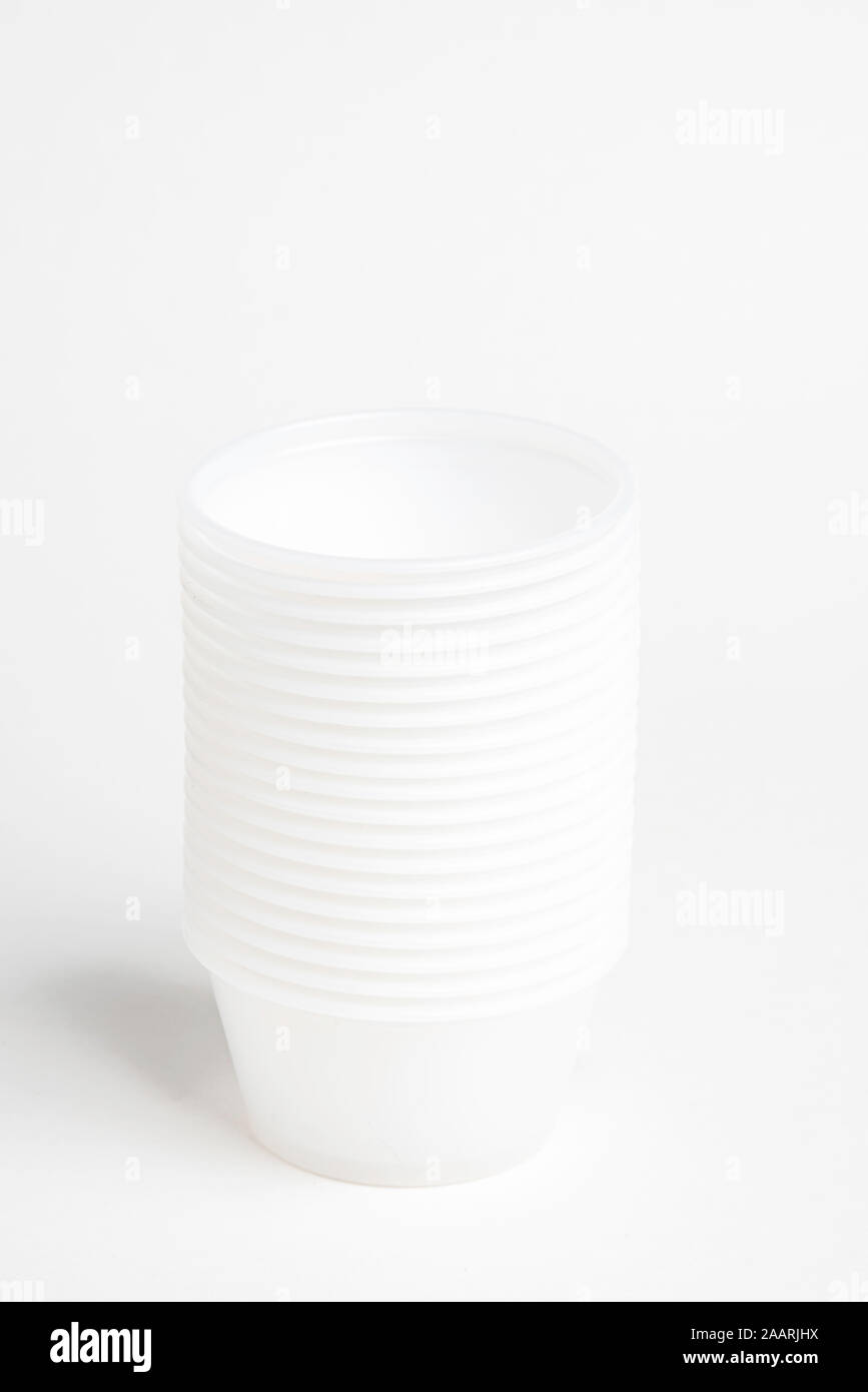 A stack of small plastic container for specimen medical laboratory ...