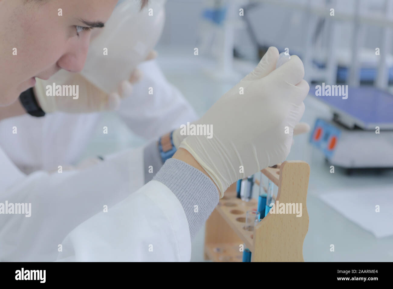 Young male scientist doing experiments in laboratory Stock Photo - Alamy