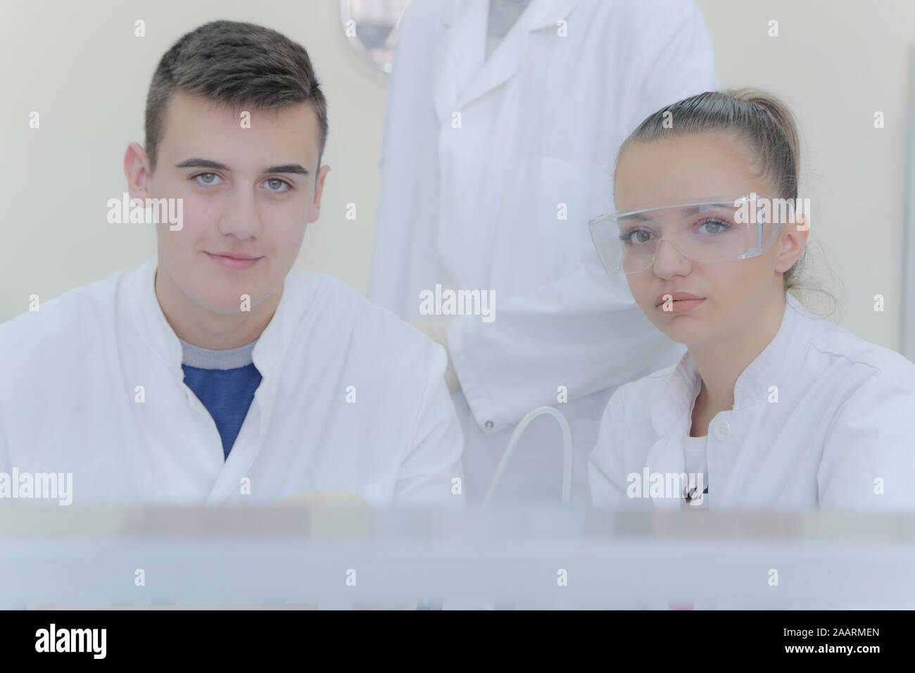 Group young people doing experiments hi-res stock photography and ...