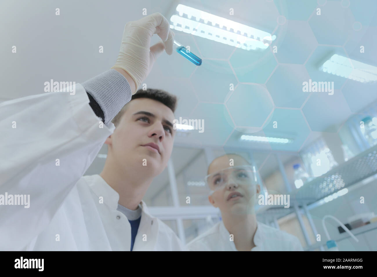 Two young students scientists doing experiments in laboratory Stock ...