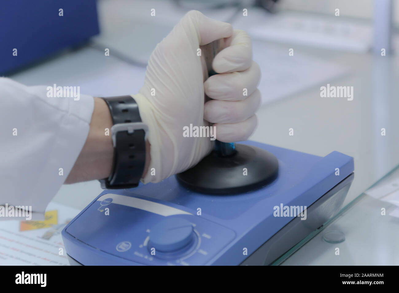 Female research scientist loading centrifuge hi-res stock photography ...