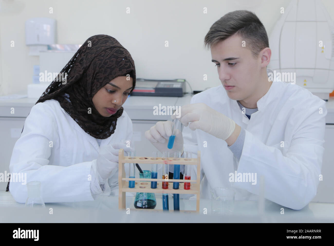 Two young student scientists doing experiments in laboratory Stock ...