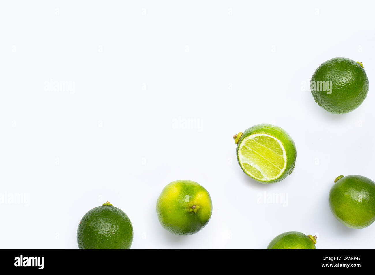 Limes isolated on white background. Copy space Stock Photo - Alamy