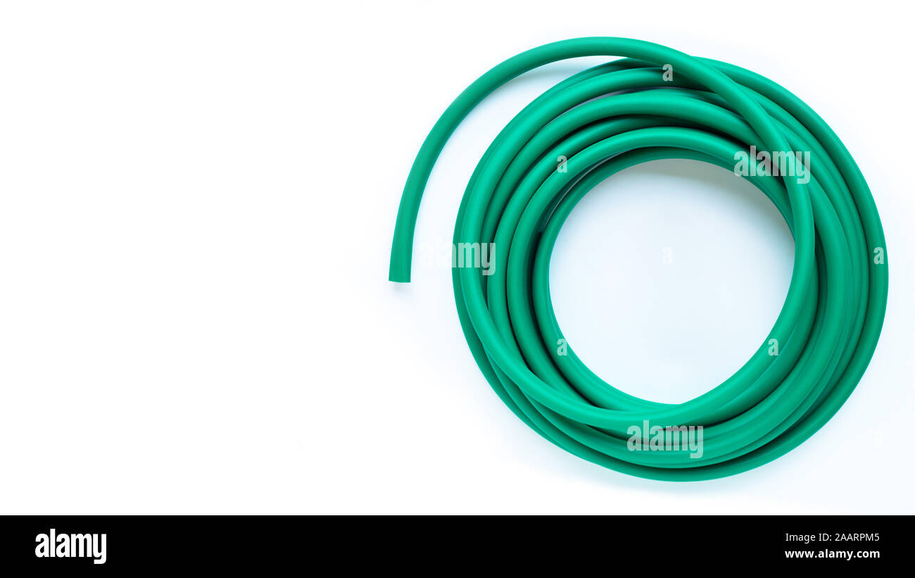 Green garden hose on white background. Copy space Stock Photo - Alamy