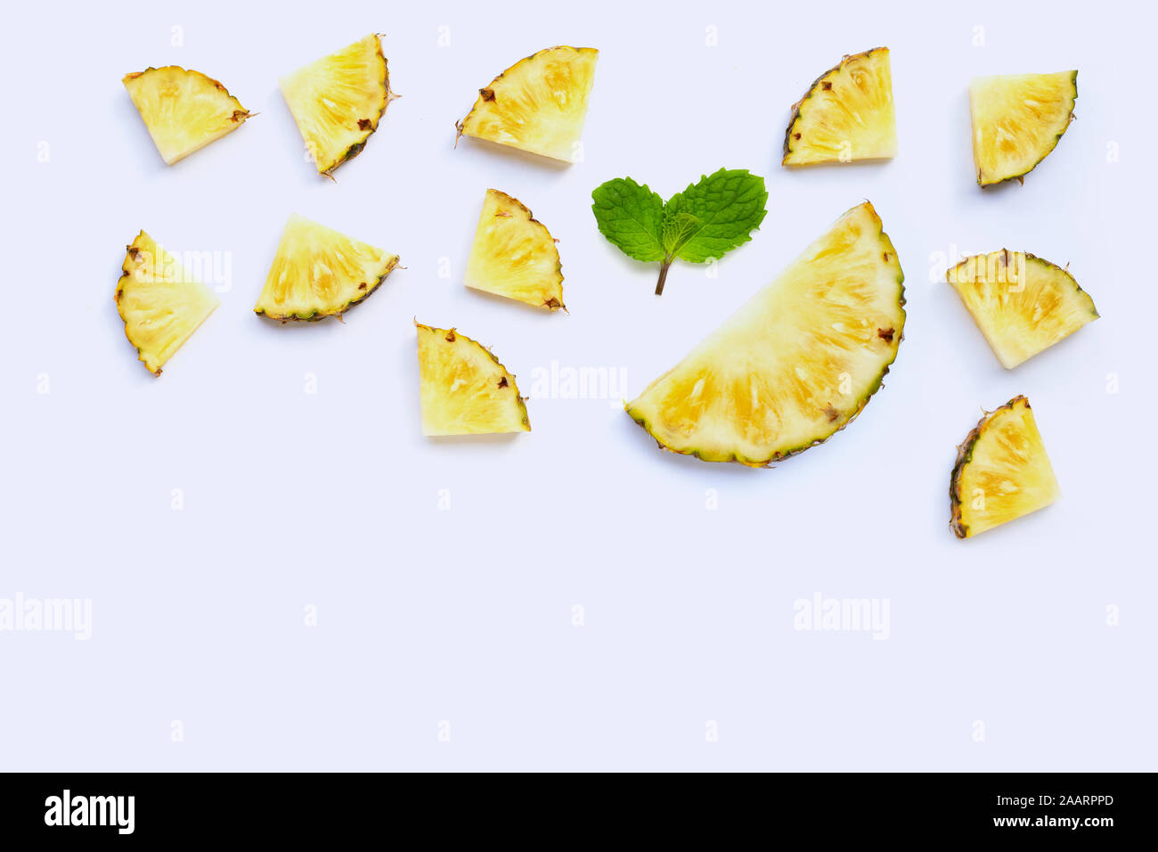 Fresh pineapple slices on white background. Copy space Stock Photo - Alamy