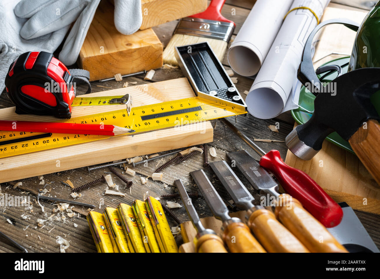 View from above of carpenter's tools on an antique wooden table ...
