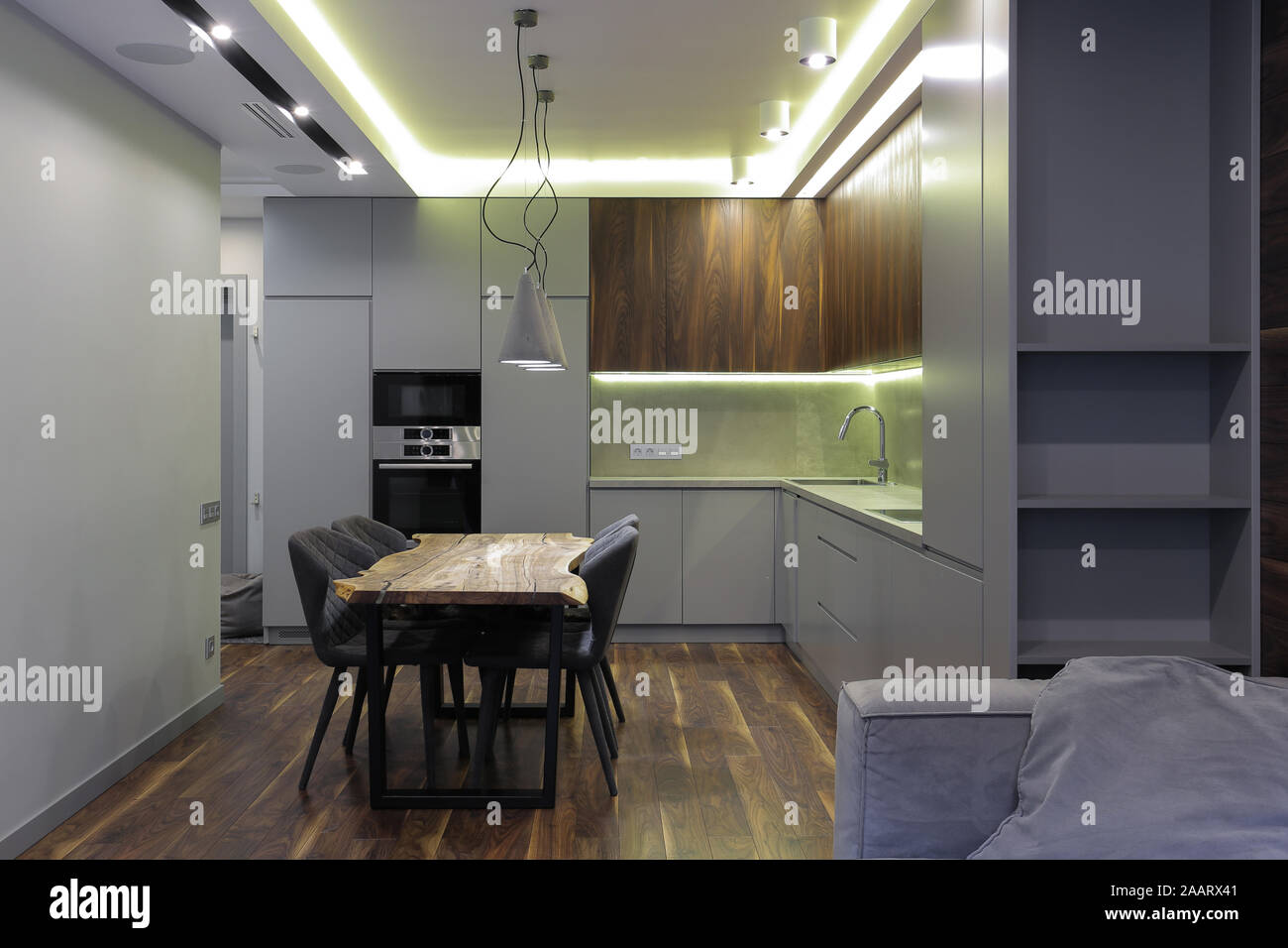 Wooden dining table in a modern kitchen interior Stock Photo - Alamy