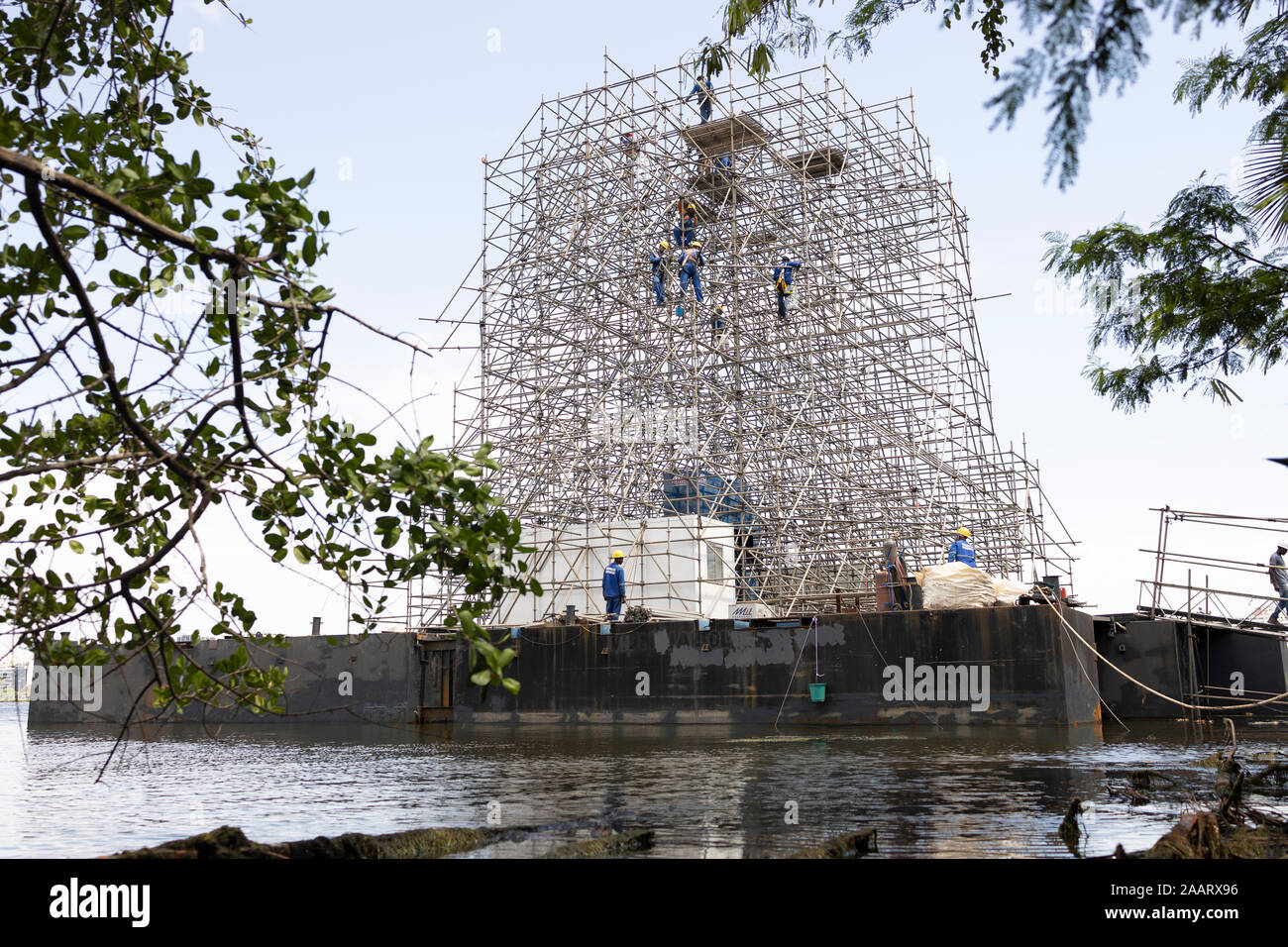 Construction workers assembling what will become the lighted floating ...