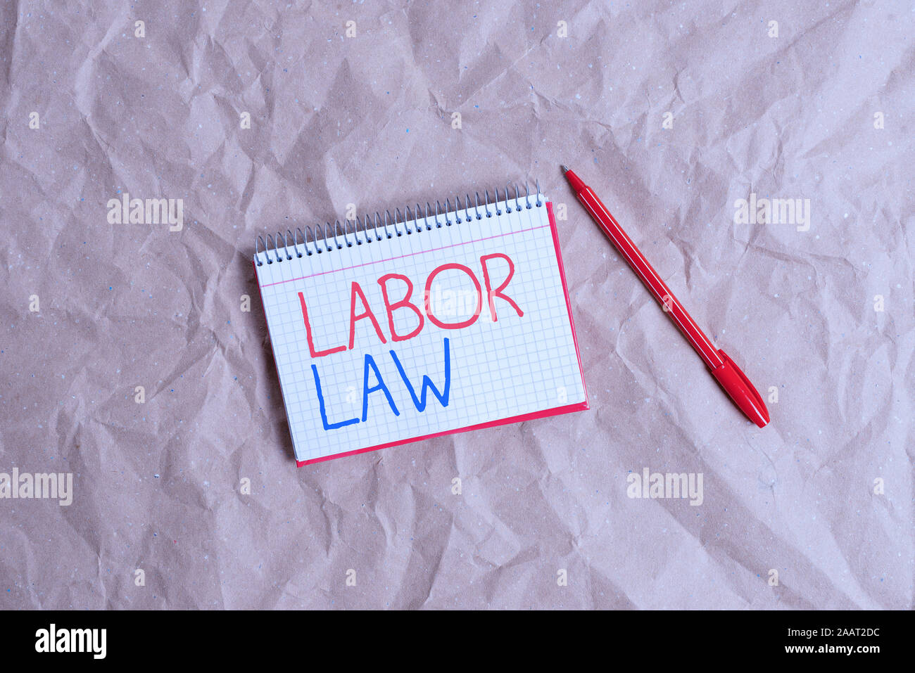 Writing note showing Labor Law. Business concept for rules relating to ...
