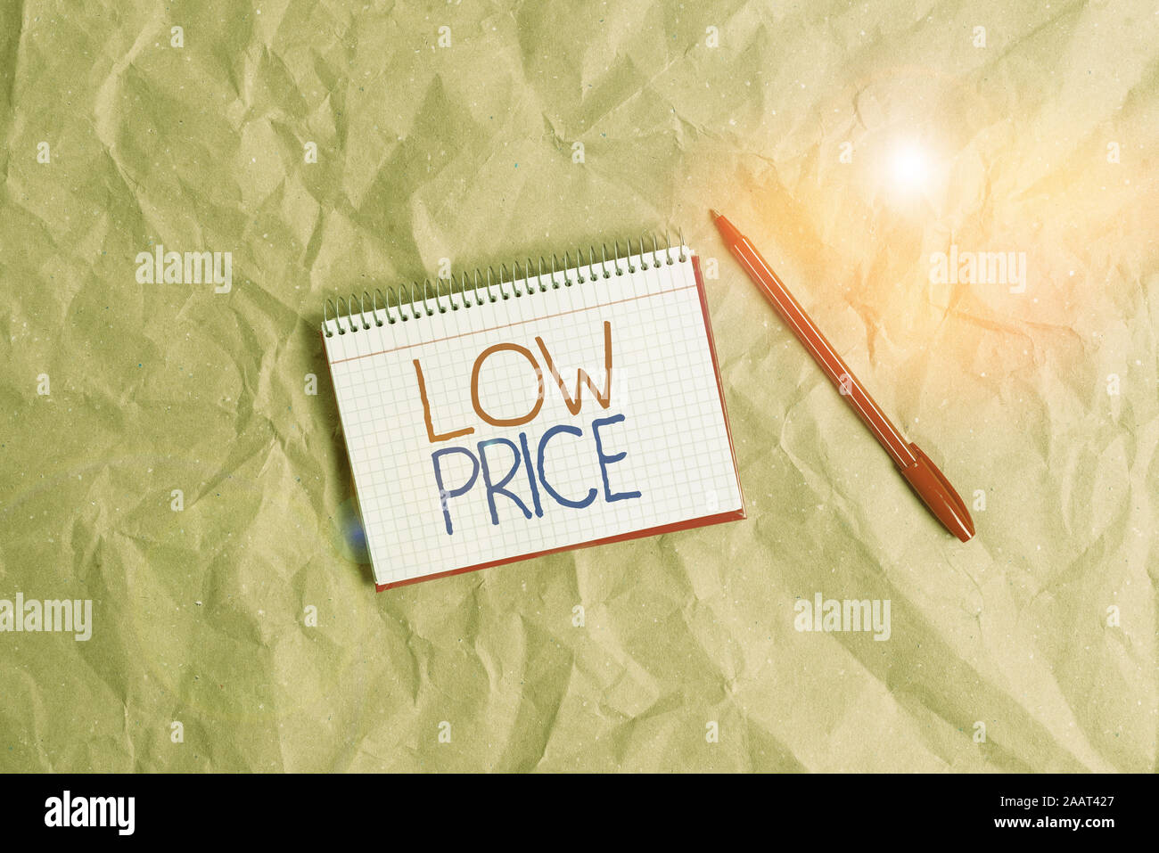 Writing note showing Low Price. Business concept for Price are the ...