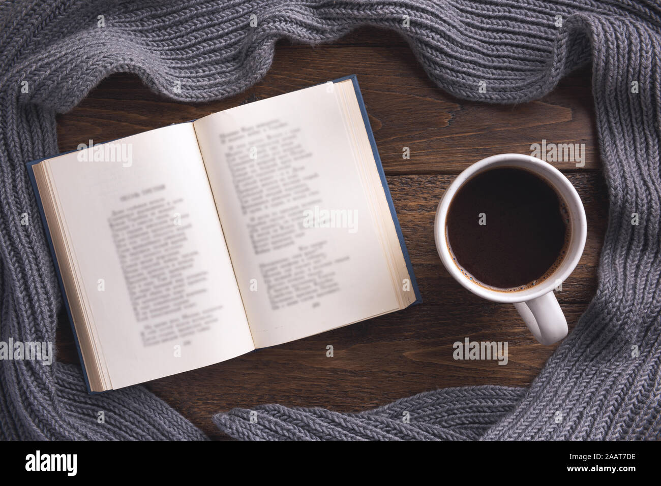 Autumn theme background with book and cup of coffe on dark wood table ...