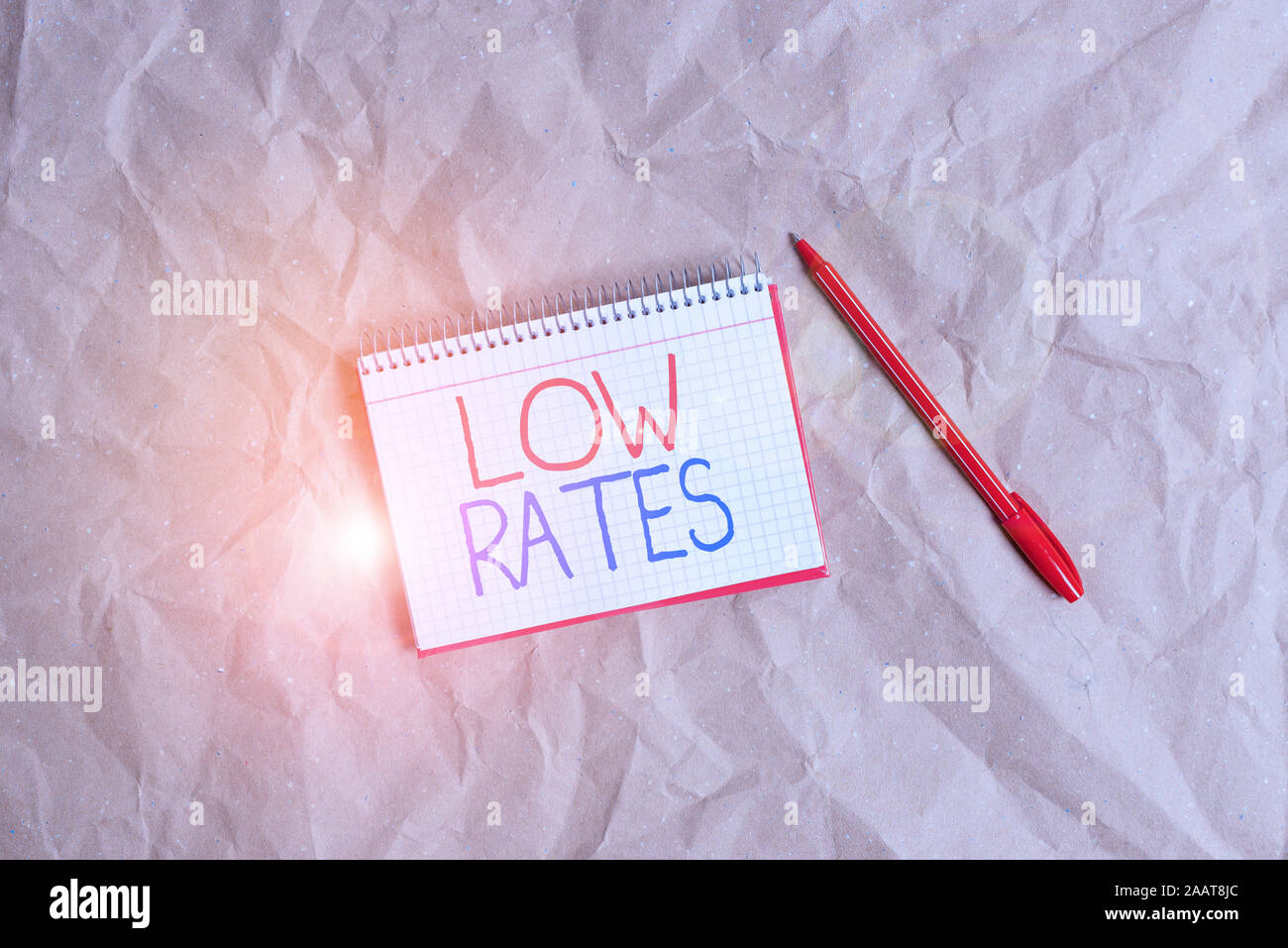 Writing note showing Low Rates. Business concept for A cost of an item ...