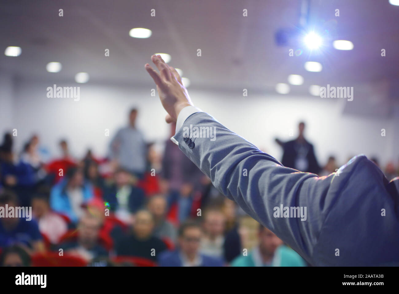 Group of students study with professor in modern big school classroom ...