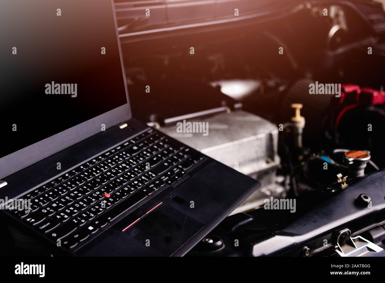 Laptop computer on car mechanic engine for service at workshop Stock ...