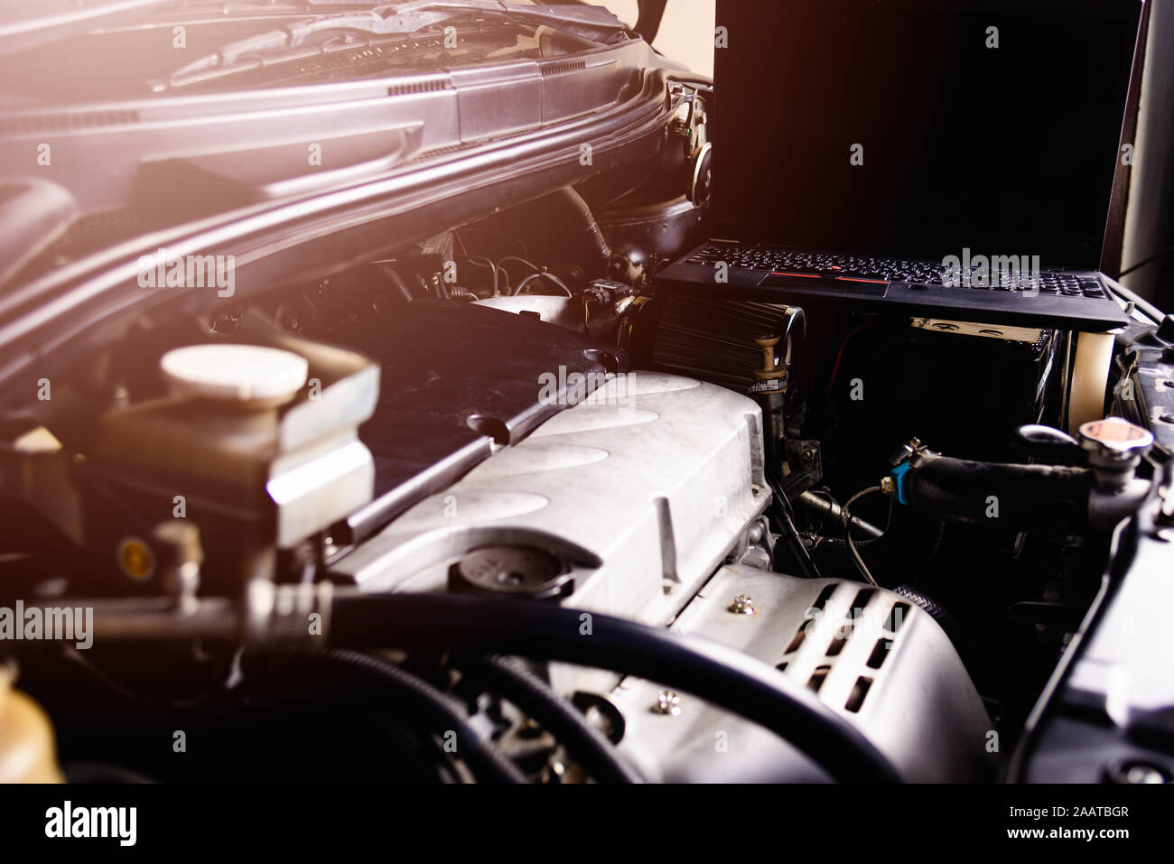 Laptop computer on car mechanic engine for service at workshop Stock ...