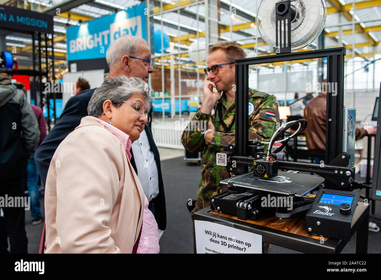 A couple taking a look at a 3D printer during the tech festival.At the ...