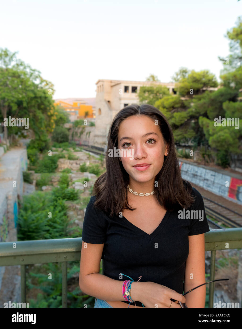 Portrait young Asian teen with sunglasses posing for camera in Athens ...