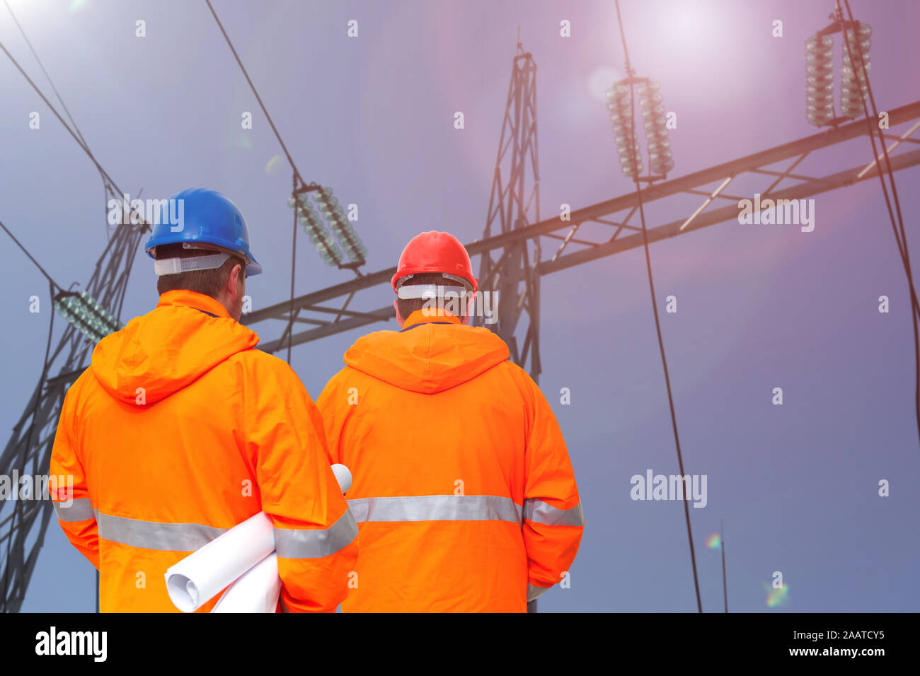 Two electrical engineers in substation, back view Stock Photo - Alamy