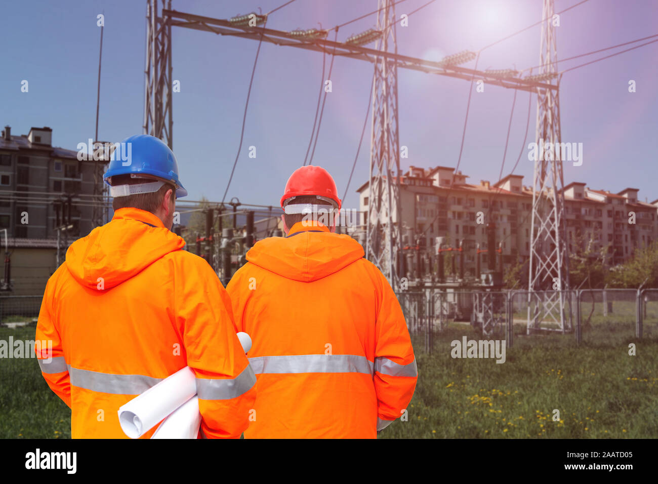 Two electrical engineers in substation, back view Stock Photo - Alamy
