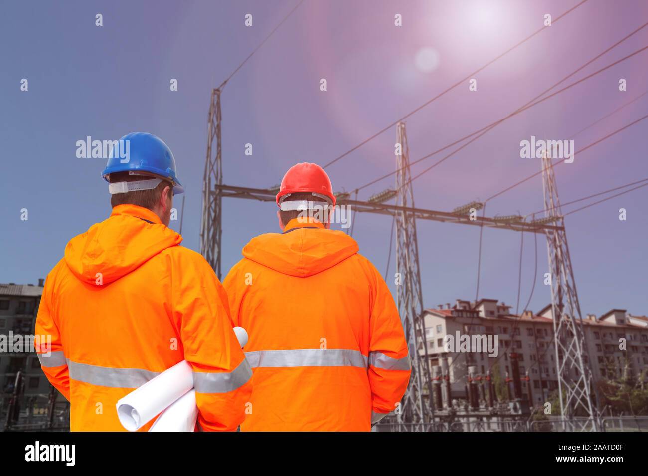 Two electrical engineers in substation, back view Stock Photo - Alamy