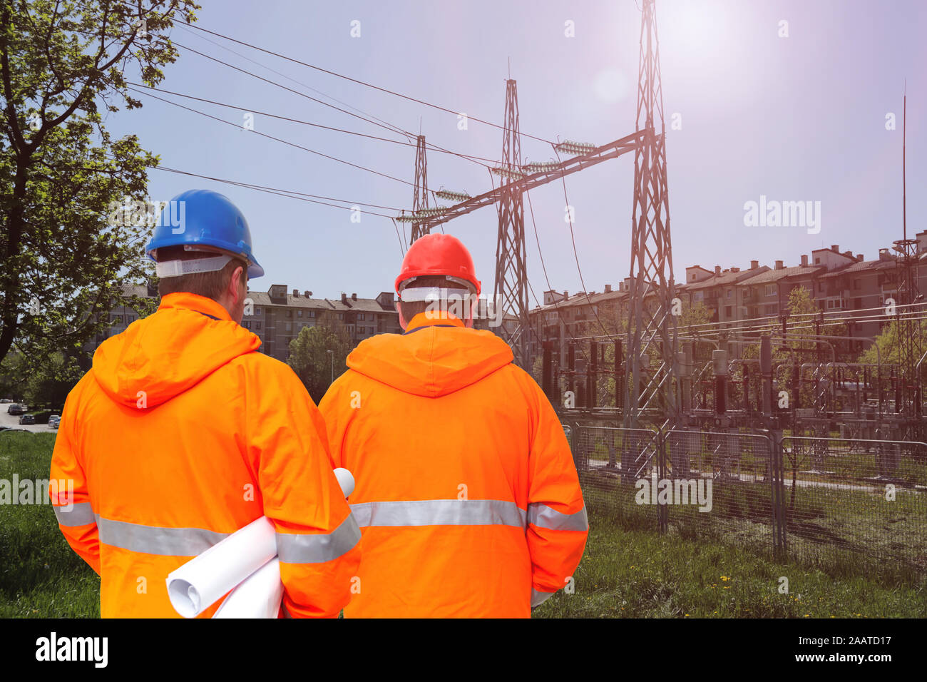 Two electrical engineers in substation, back view Stock Photo - Alamy