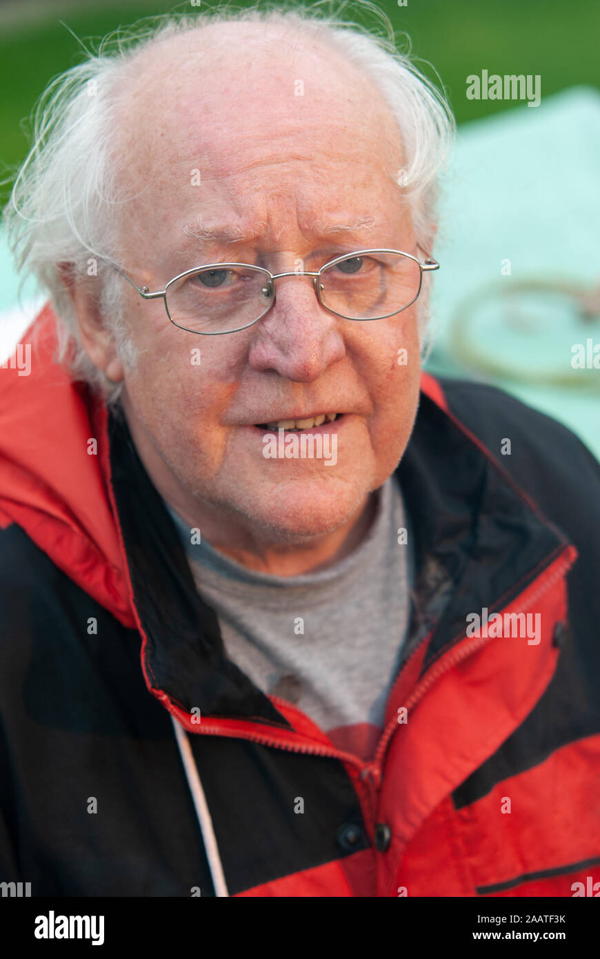 Retired man in red jacket hi-res stock photography and images - Alamy