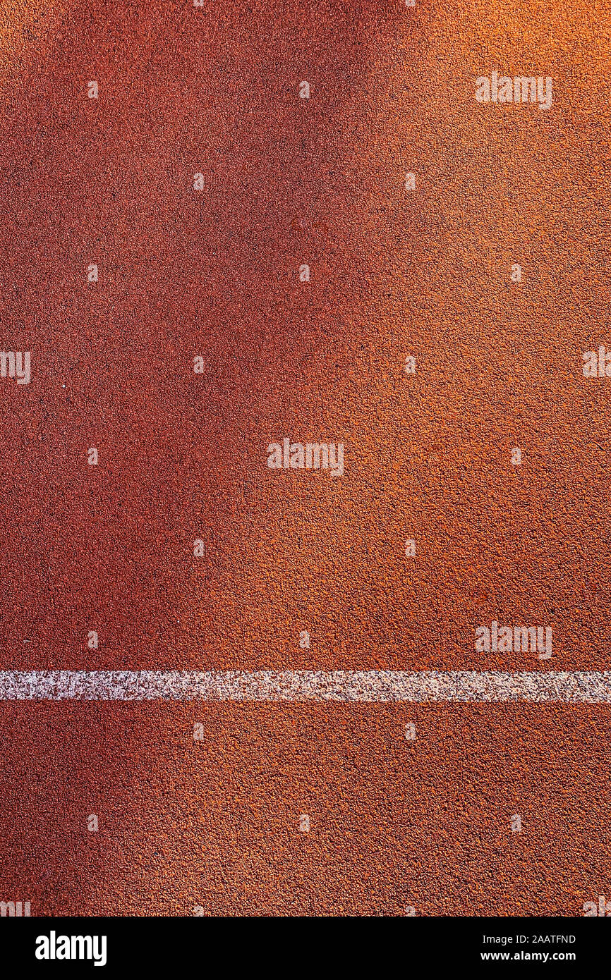Top view of white line on orange running track with sunlight Stock ...