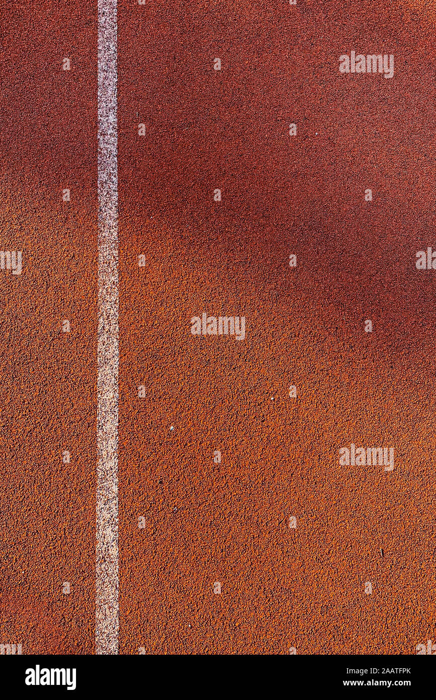 Top view of white line on orange running track with sunlight Stock ...