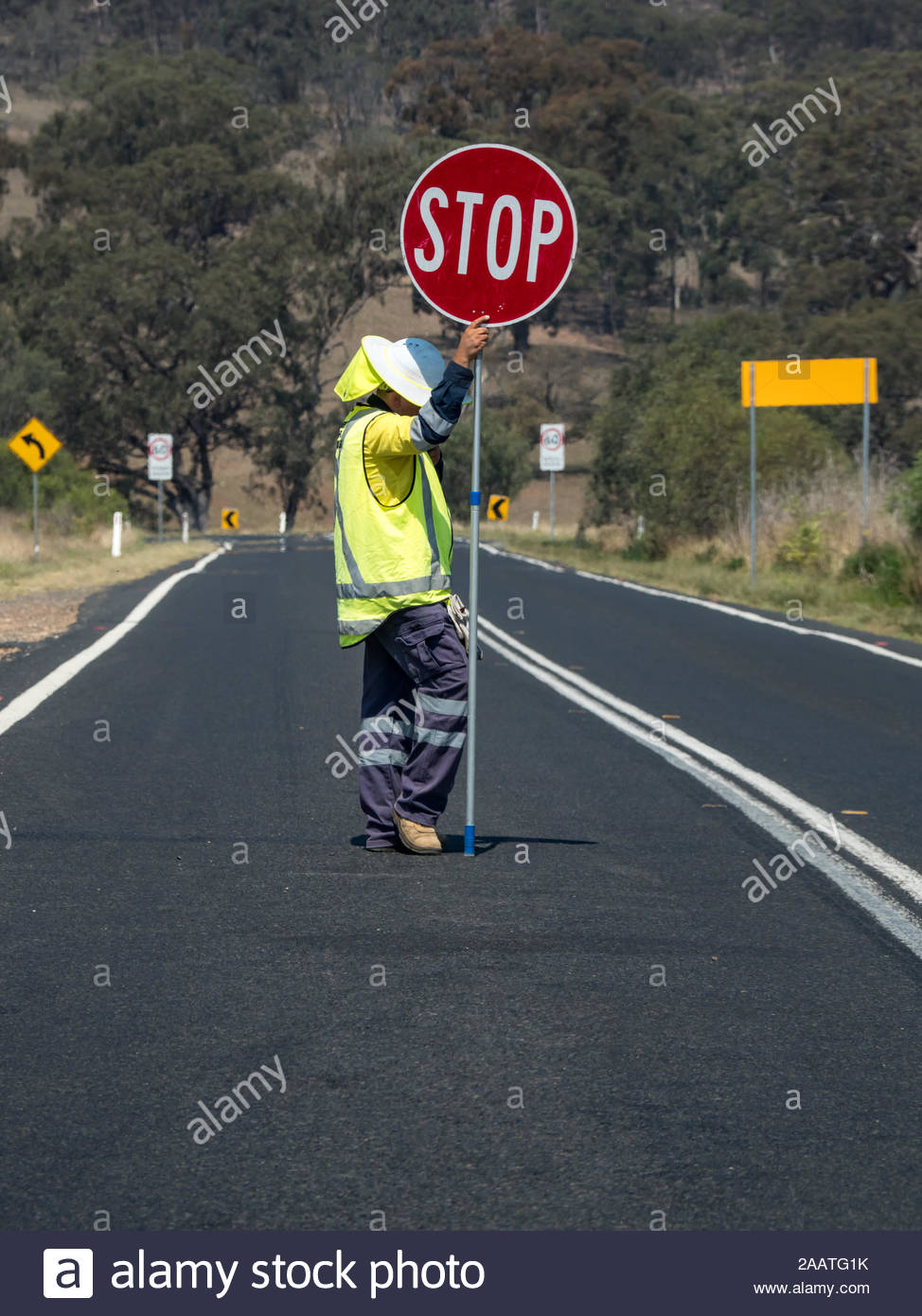 Worker Holding Stop Sign Stock Photos & Worker Holding Stop Sign Stock ...