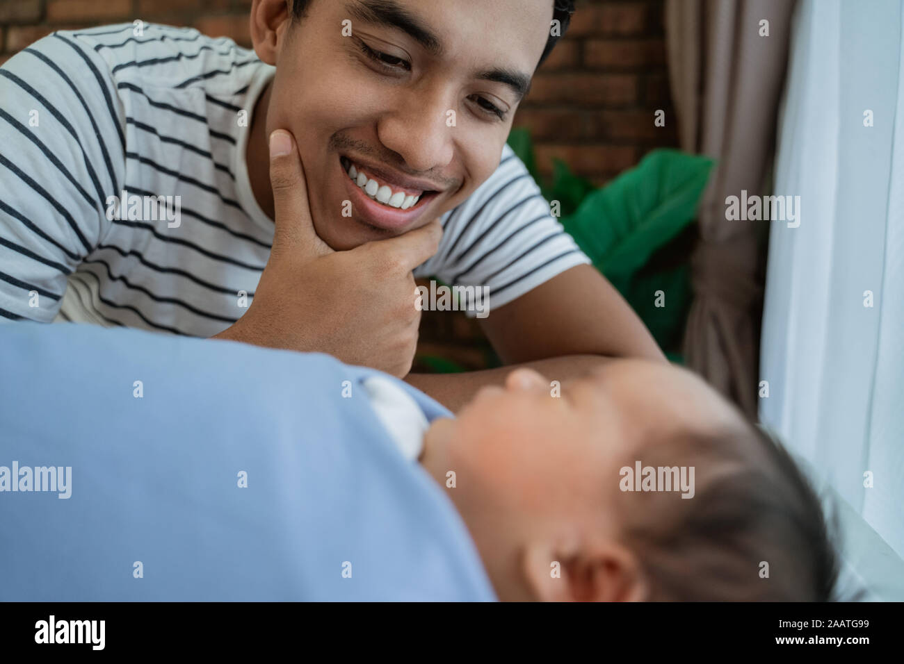 young father look at daughter when adorable sleep Stock Photo - Alamy