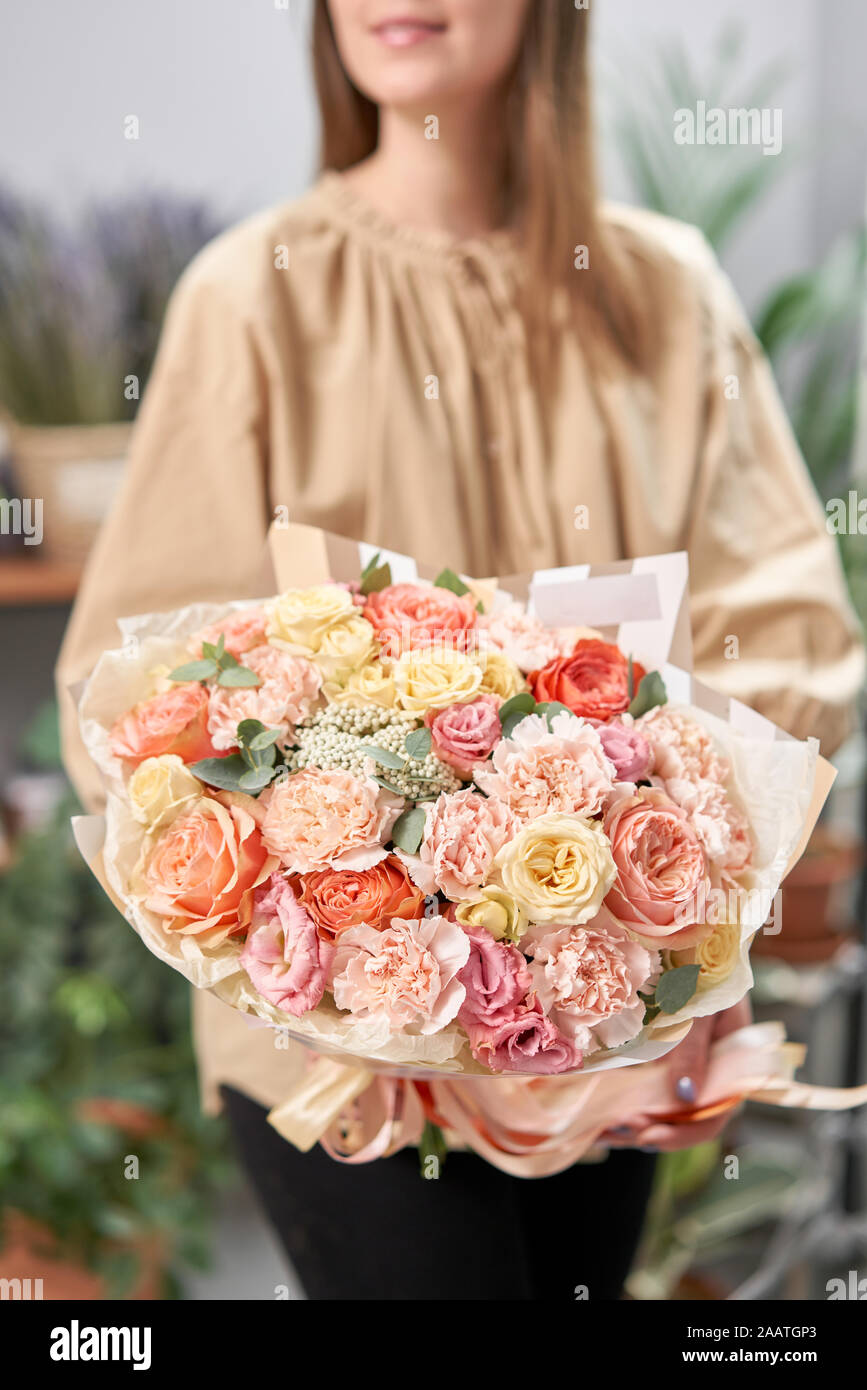 Modern floral shop. Finished work of the florist. Cute bouquet of mixed ...
