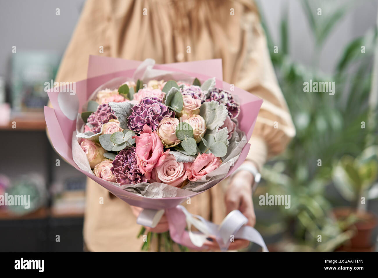 Modern floral shop. Finished work of the florist. Cute bouquet of mixed ...