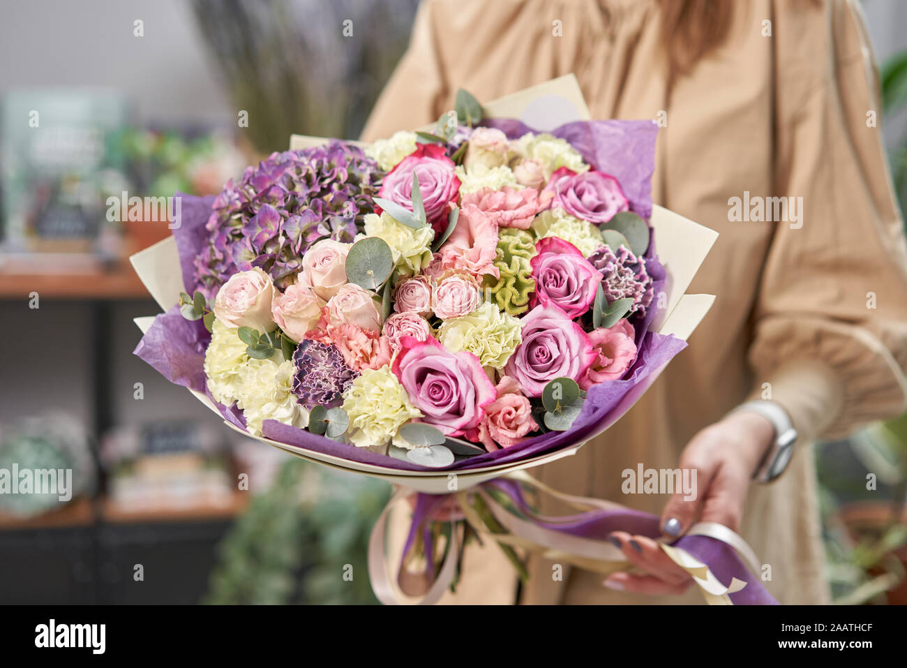 Modern floral shop. Finished work of the florist. Cute bouquet of mixed ...