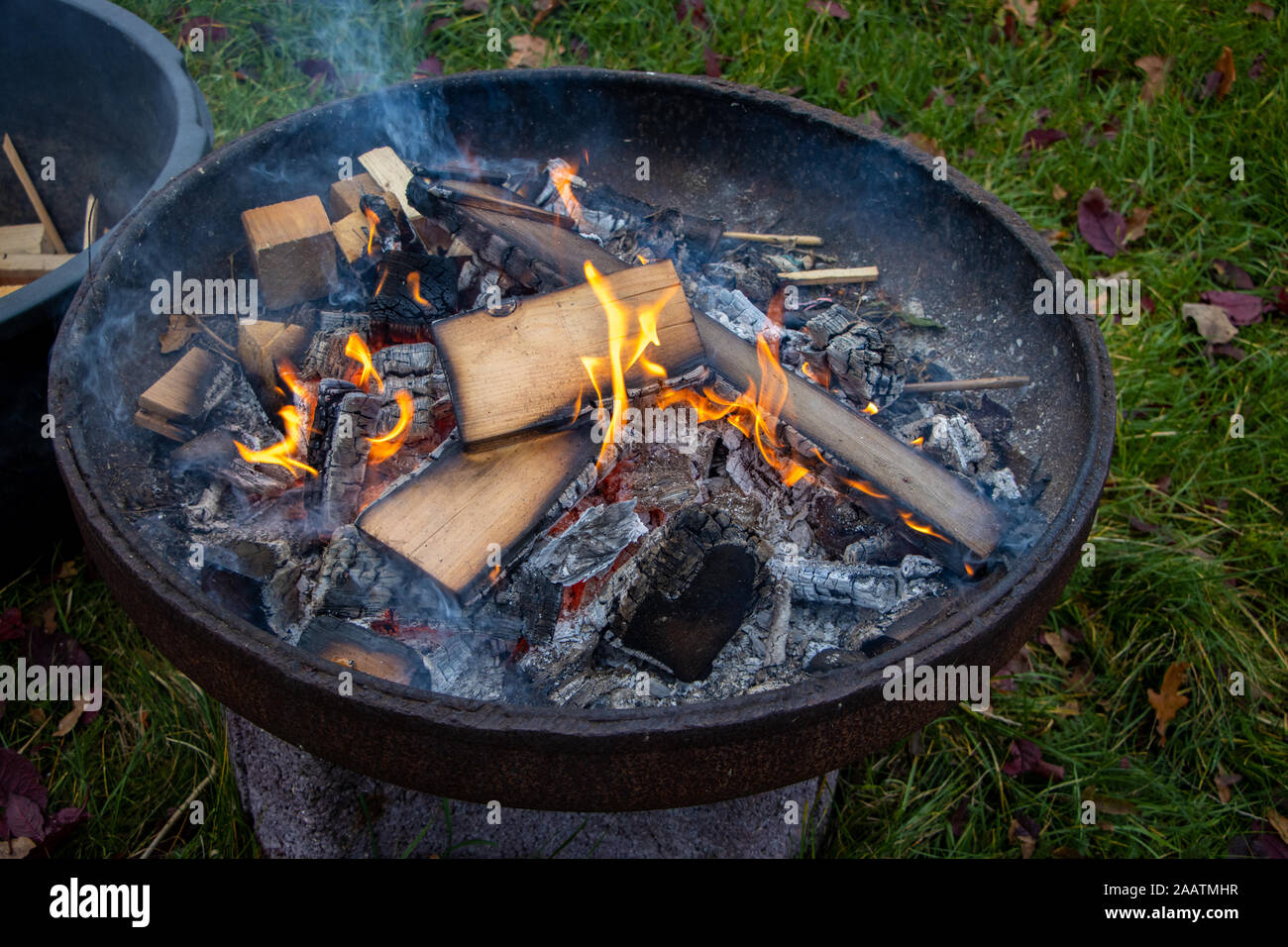 A small fire burns in a fire bowl Stock Photo - Alamy
