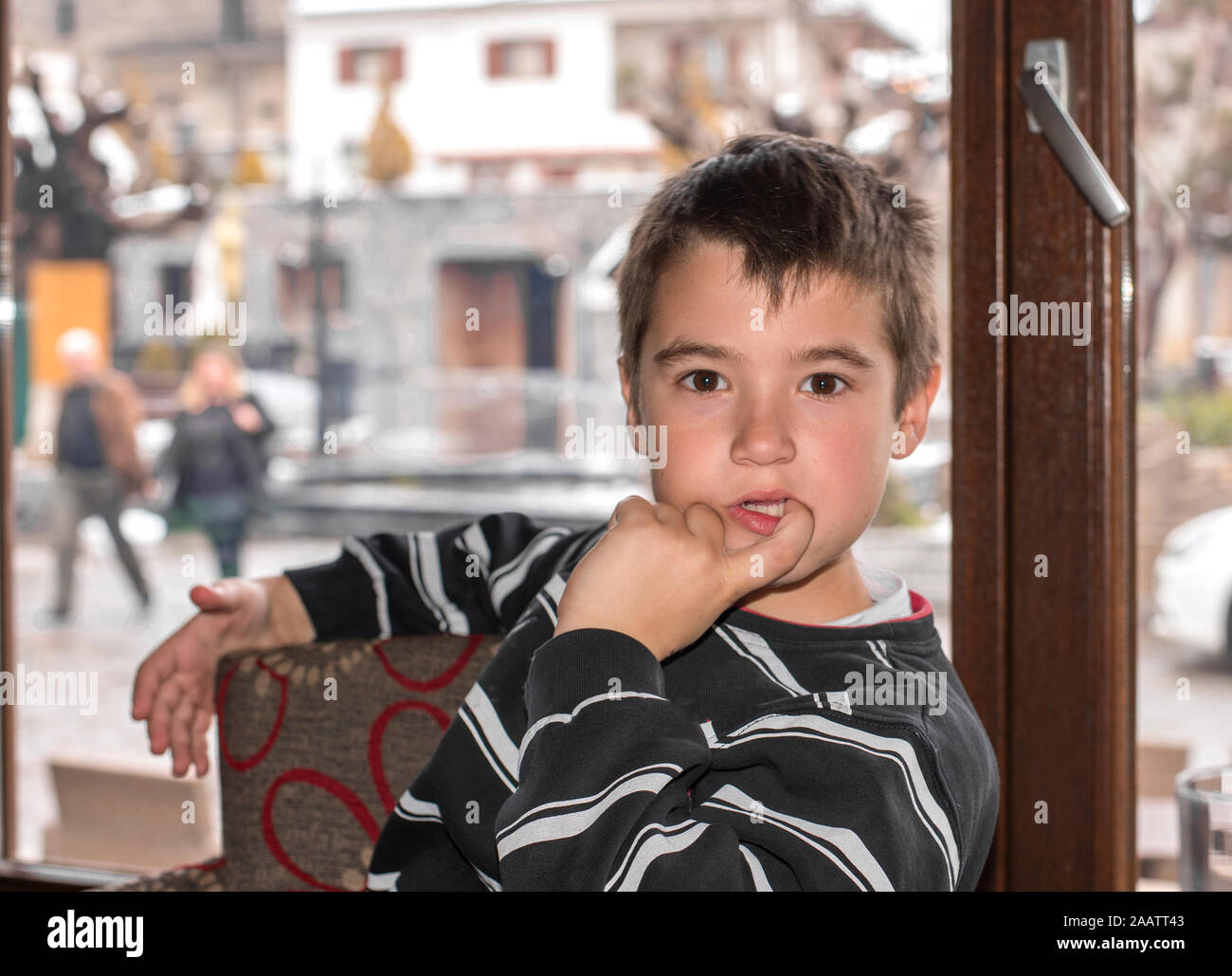 Portrait of a little boy on front of window Stock Photo - Alamy