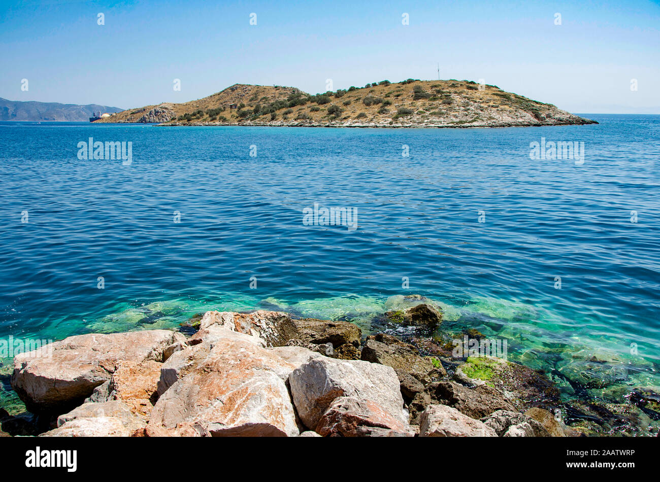 seascapes. Big rocks and a small deserted island in Greece Stock Photo ...