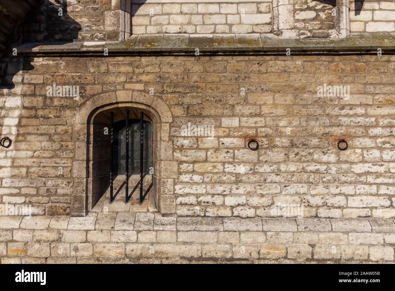 Abstract medieval brick wall with barred window Stock Photo - Alamy