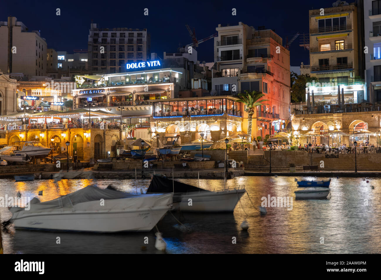 Paceville district at night in St Julian town in Malta, popular ...