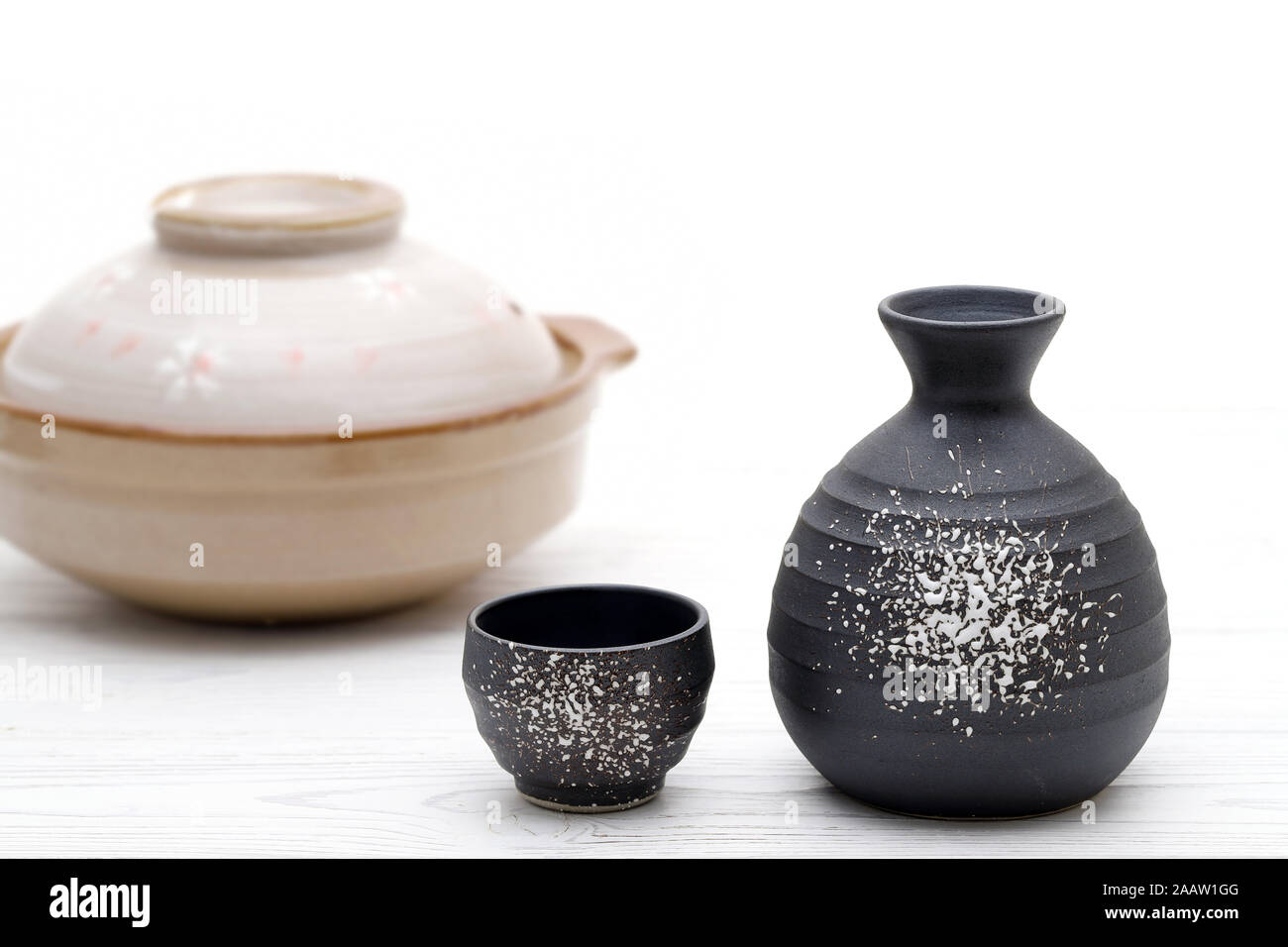 Japanese traditional sake cup and bottle on white background Stock ...