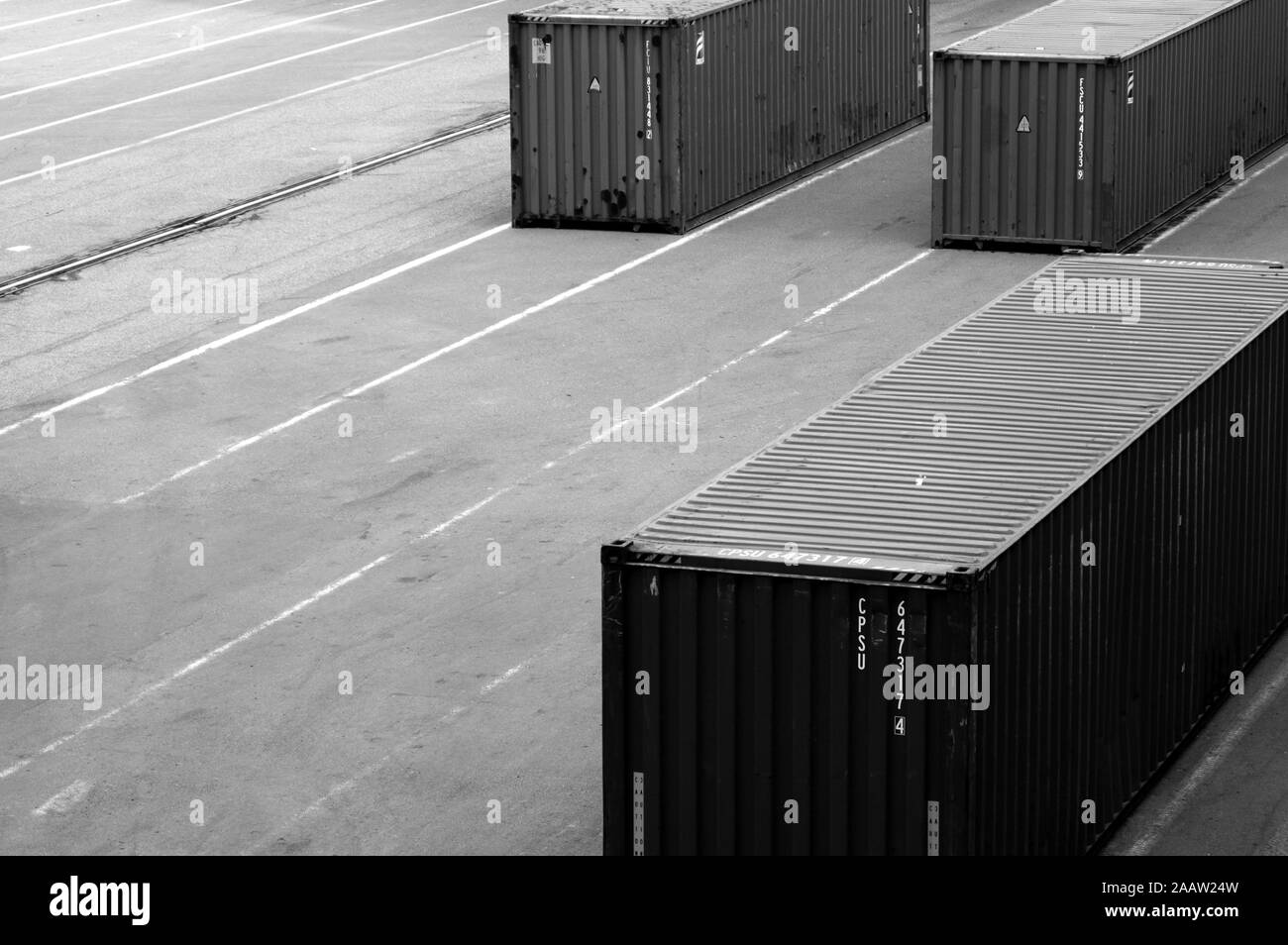 Freight shipping containers at the docks Stock Photo - Alamy
