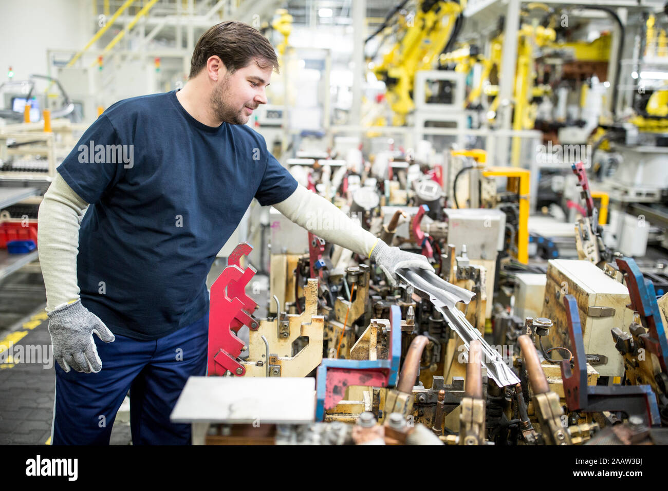 Man working in a modern factory Stock Photo - Alamy