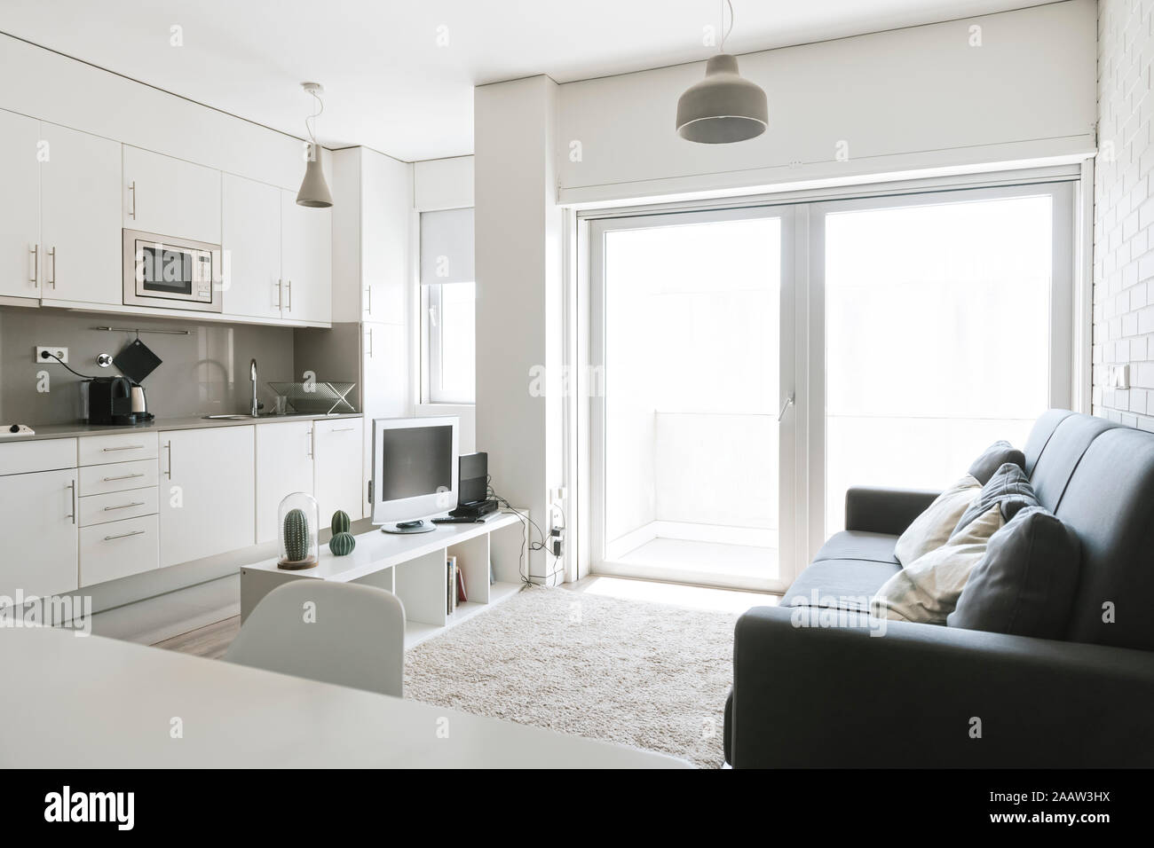 Modern loft with open plan kitchen Stock Photo - Alamy