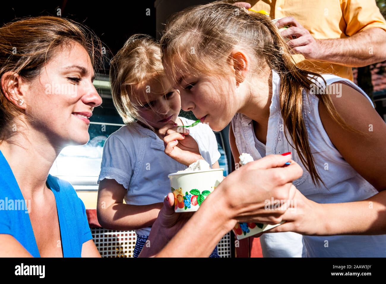 Family having ice cream at an ice cream parlor Stock Photo - Alamy