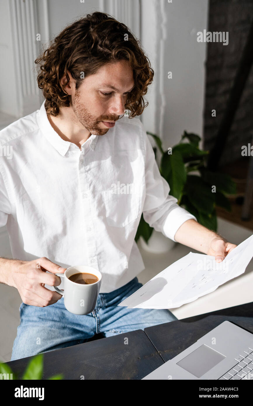 Reviewing papers hi-res stock photography and images - Alamy