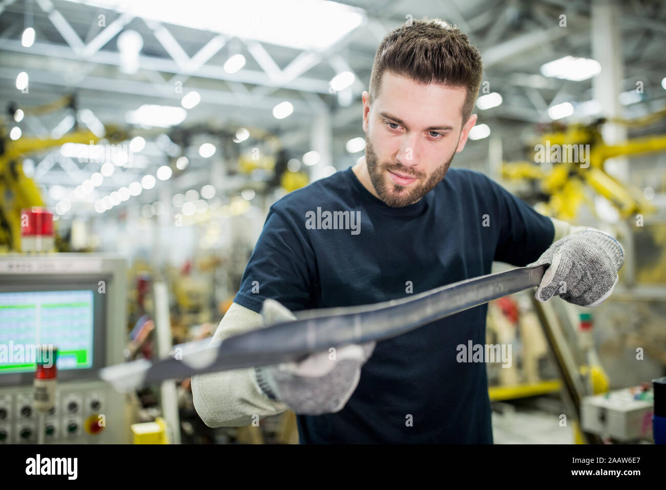 Man working in a modern factory Stock Photo - Alamy