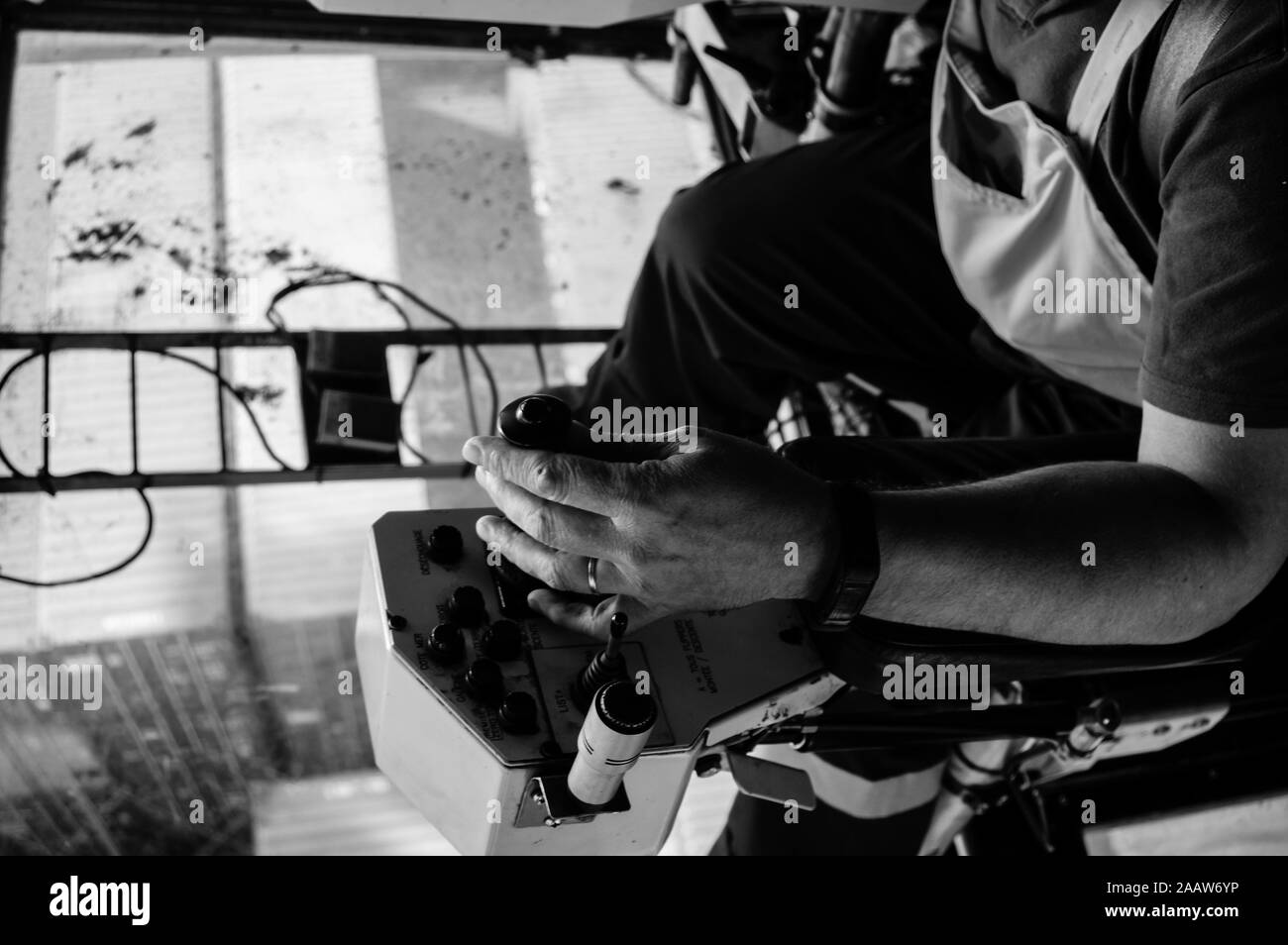 Gantry crane operator moving a sea container in the Port Stock Photo ...