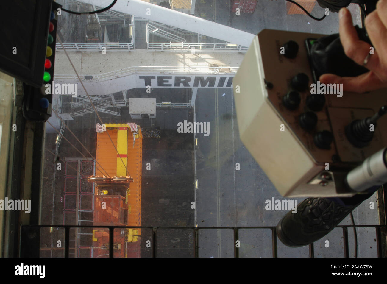 Gantry crane operator moving a sea container in the Port Stock Photo ...