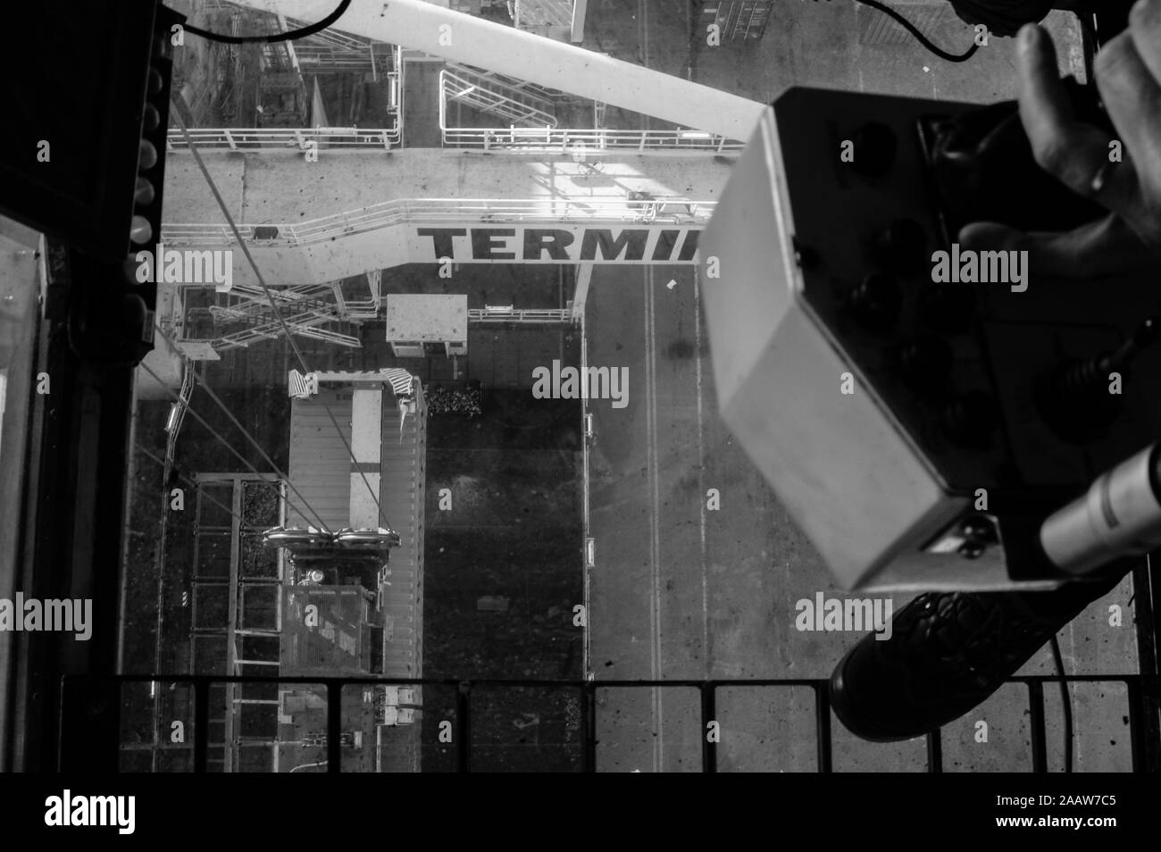 Gantry crane operator moving a sea container in the Port Stock Photo ...