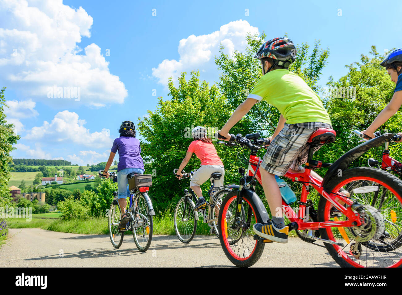 Three generations doing a cycling tour in beautiful nature in southern ...